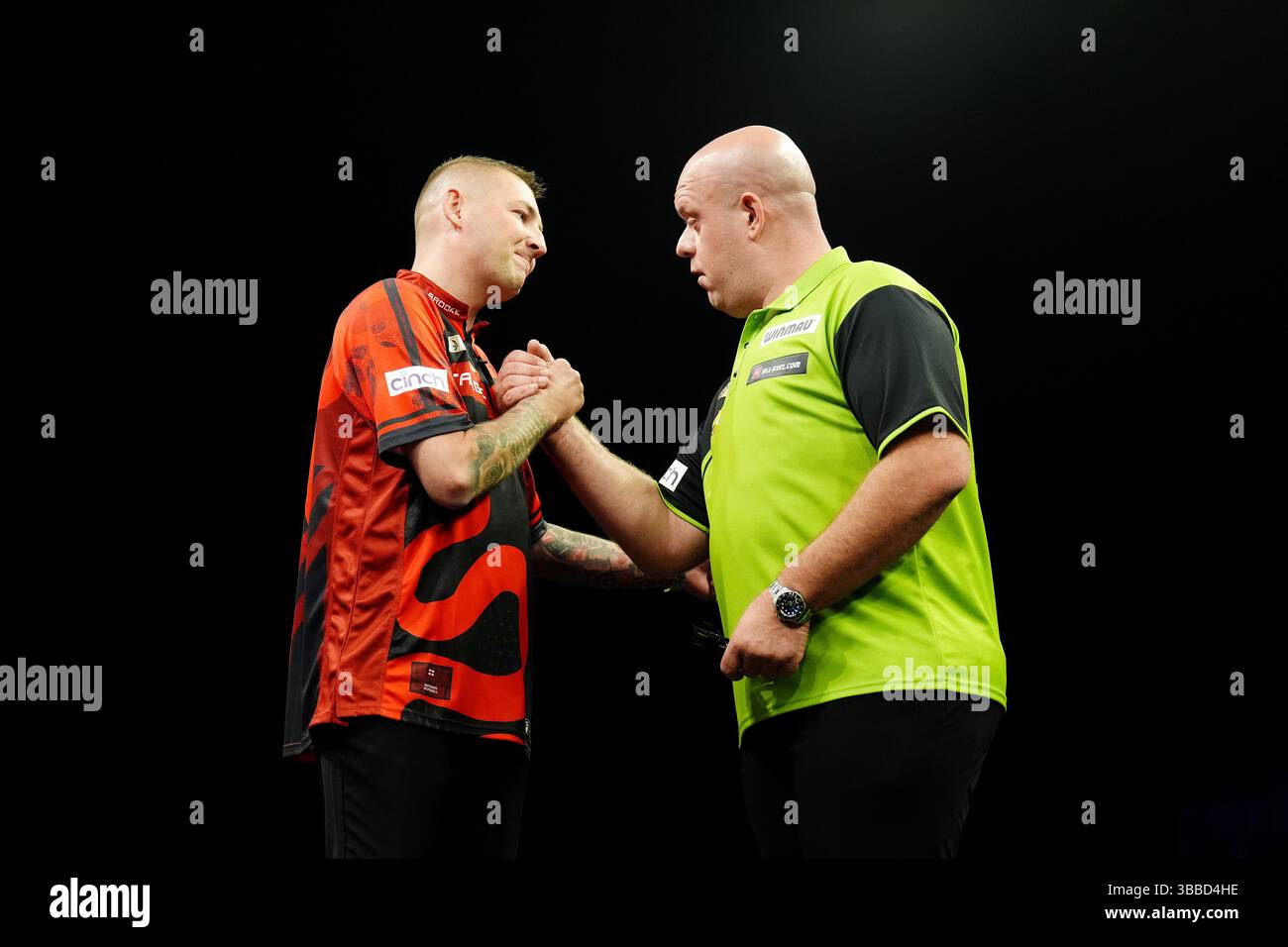 Nathan Aspinall wins his match and embraces Michael van Gerwen (right ...