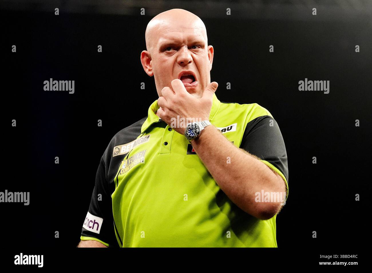 Michael van Gerwen reacts during their match against Nathan Aspinall ...