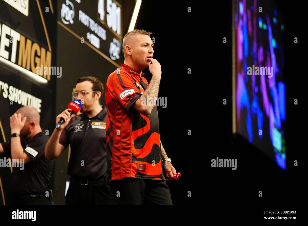 Nathan Aspinall gestures to the crowd during their match against ...