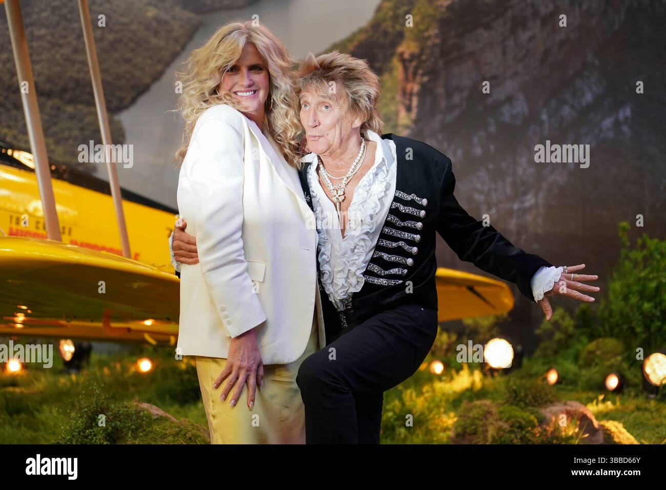 Penny Lancaster, left, and Rod Stewart pose for photographers upon ...