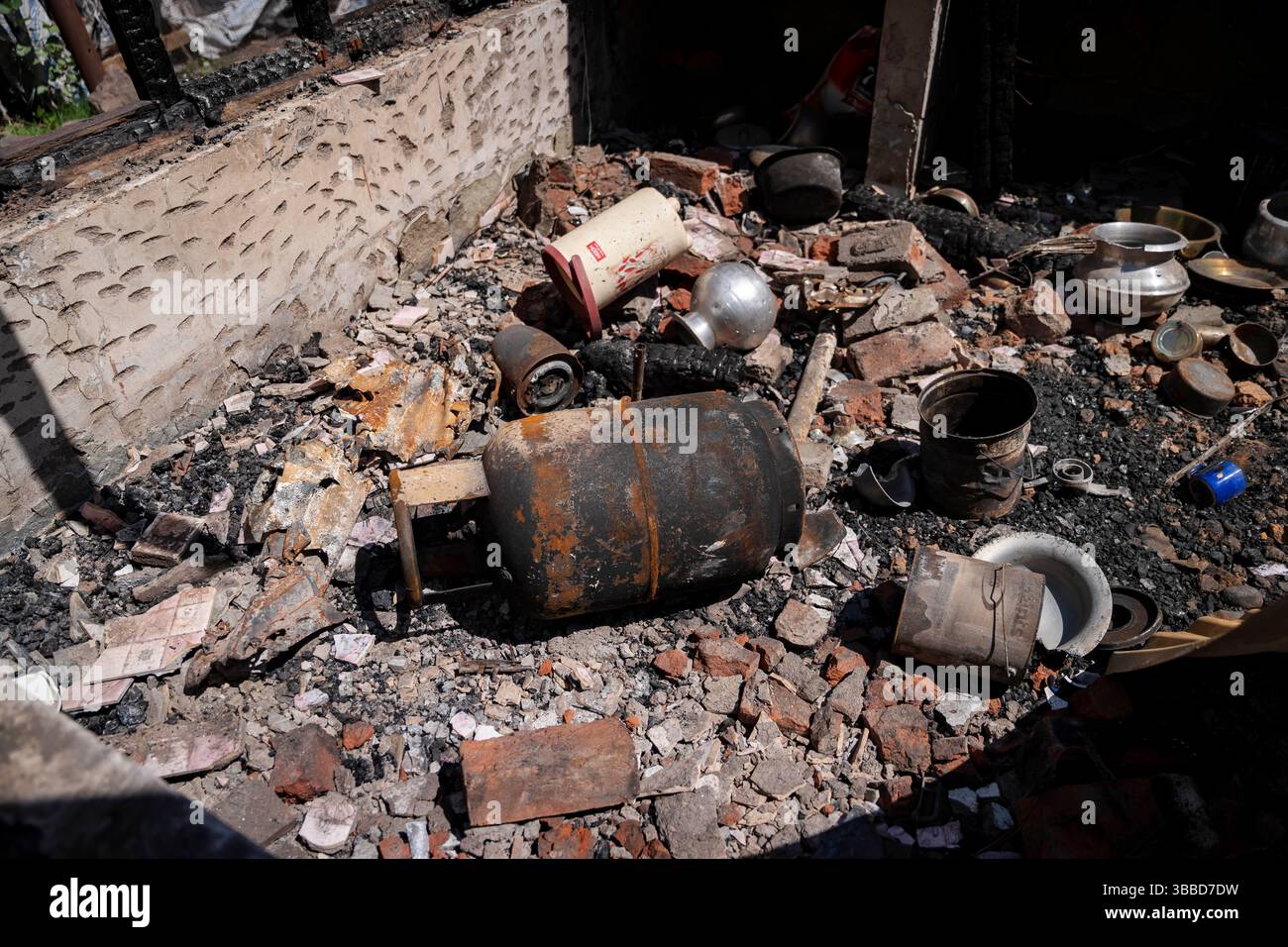 Damaged utensils are seen inside a house damaged in cross-border ...
