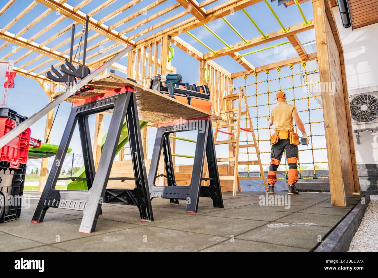Construction worker intently working hi-res stock photography and ...