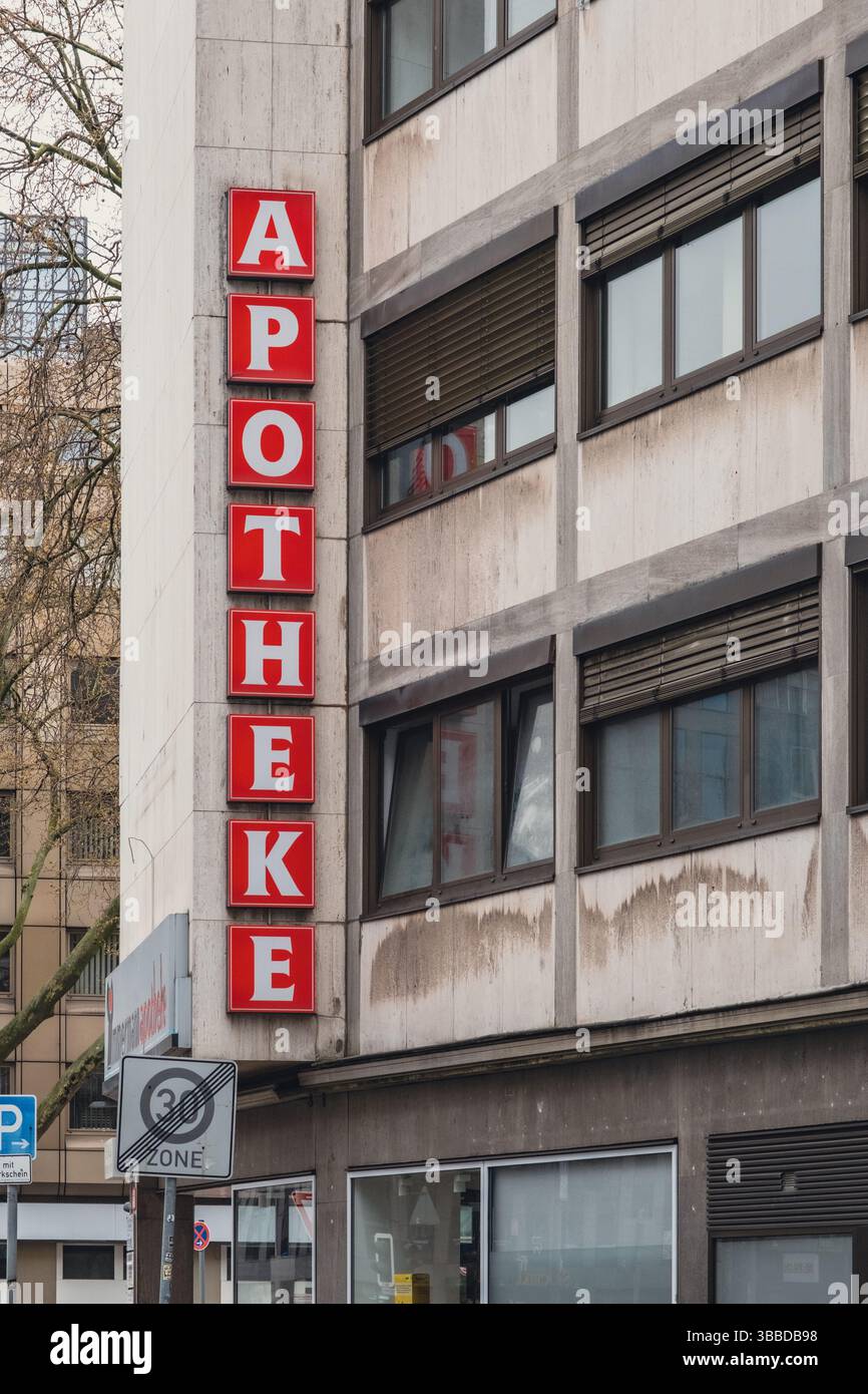 Classic vertical pharmacy sign on building wall Stock Photo - Alamy