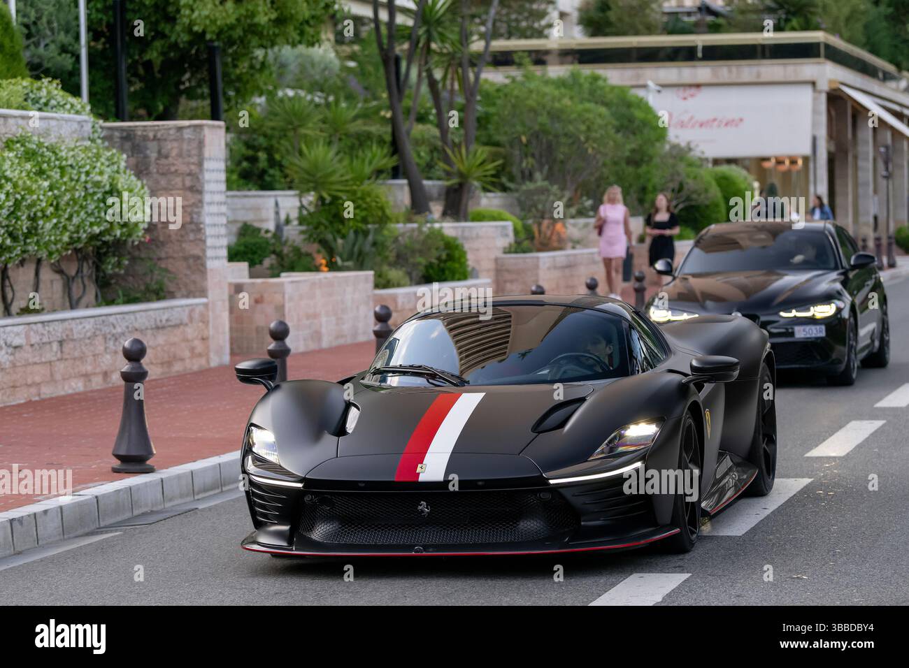 Monte Carlo, Monaco - View on a matte black Ferrari Daytona SP3 driving ...