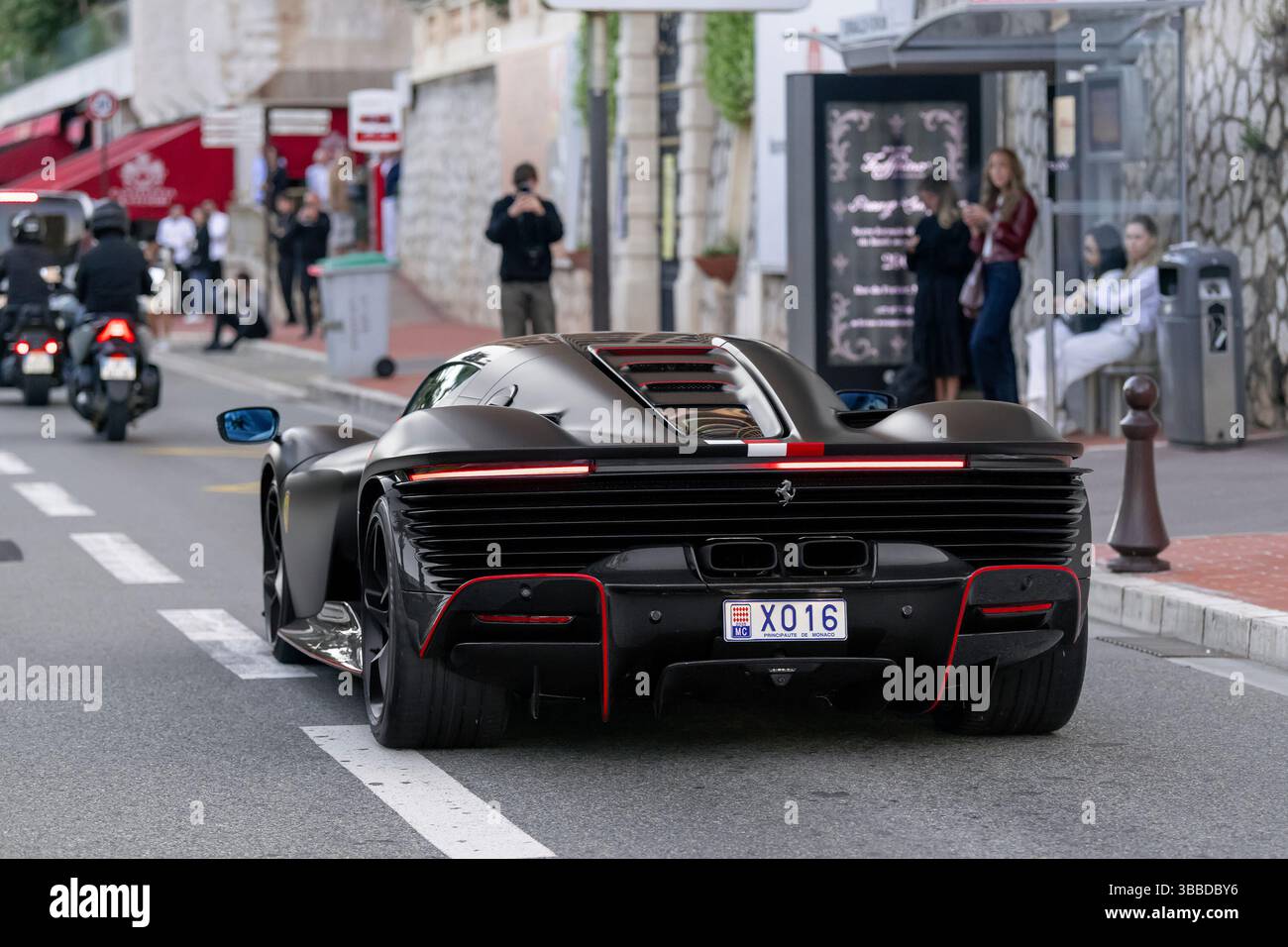 Monte Carlo, Monaco - View on a matte black Ferrari Daytona SP3 driving ...