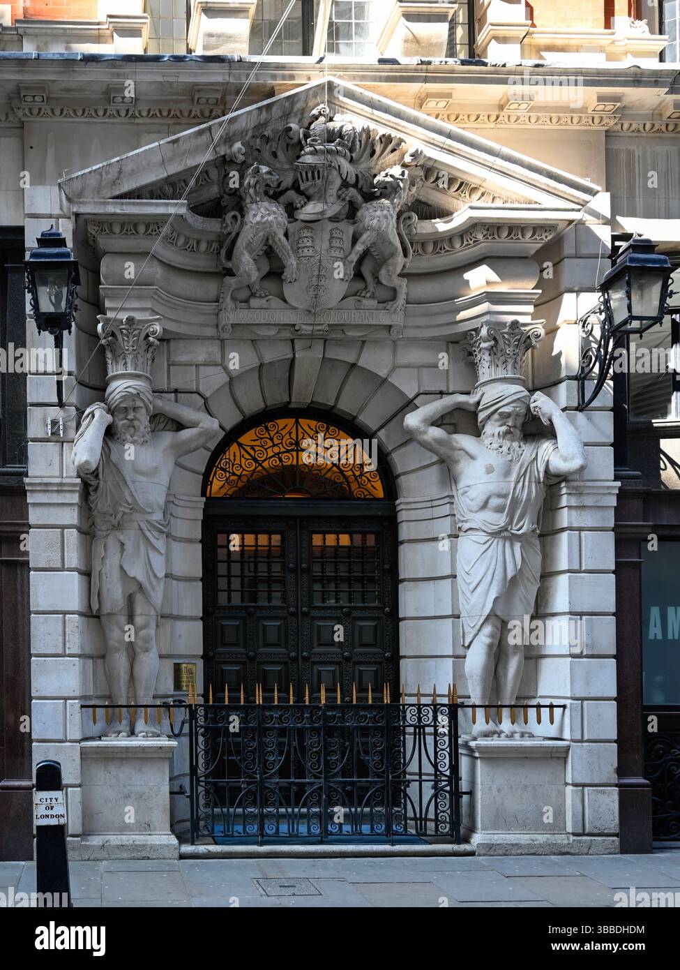 LONDON UK - APRIL 30, 2025: Entrance door with coat of Arms and motto ...