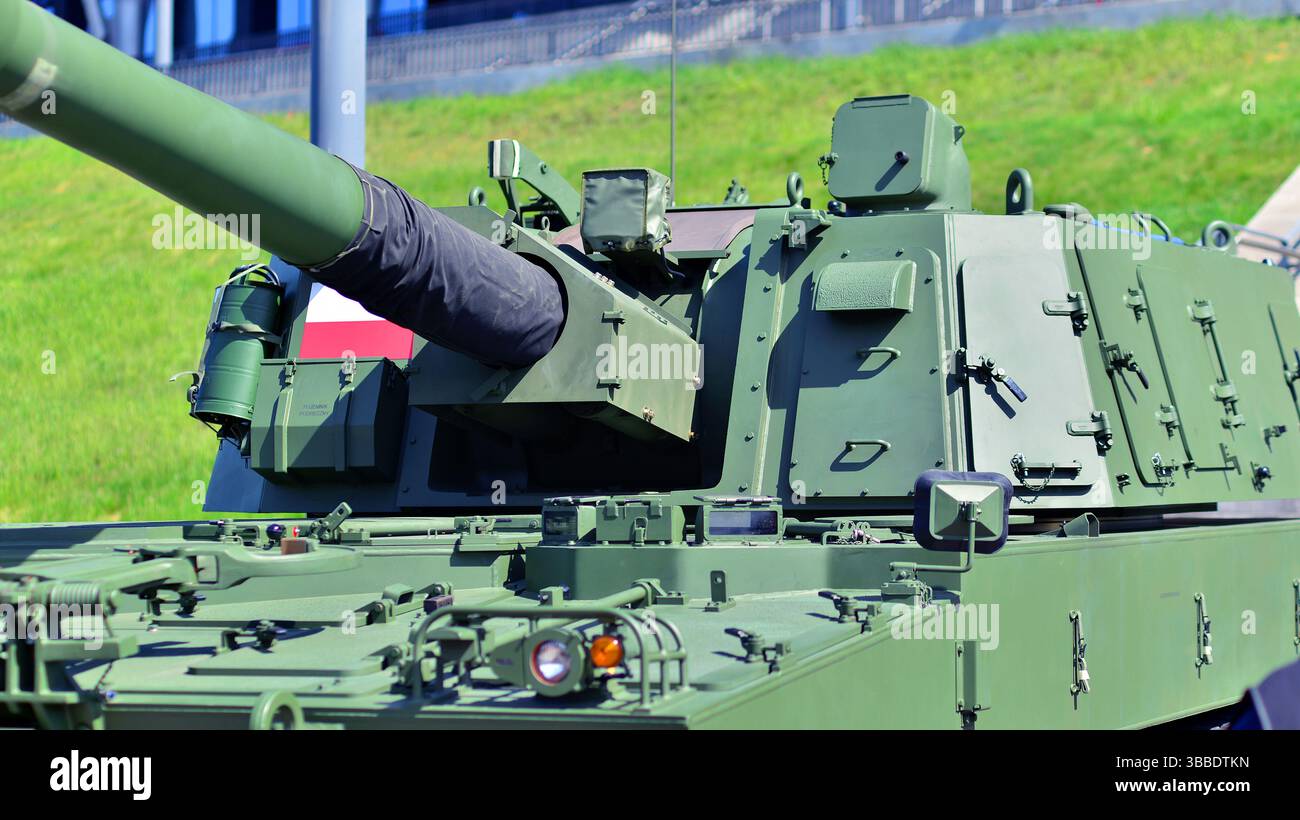 Heavy military tank vehicle turret gun aiming on a target and ready to ...