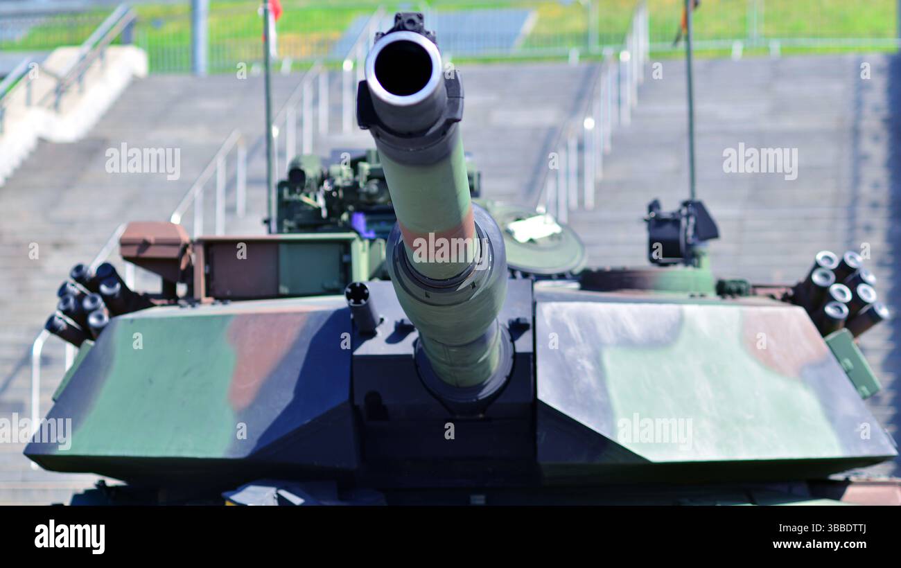 Heavy military tank vehicle turret gun aiming on a target and ready to ...