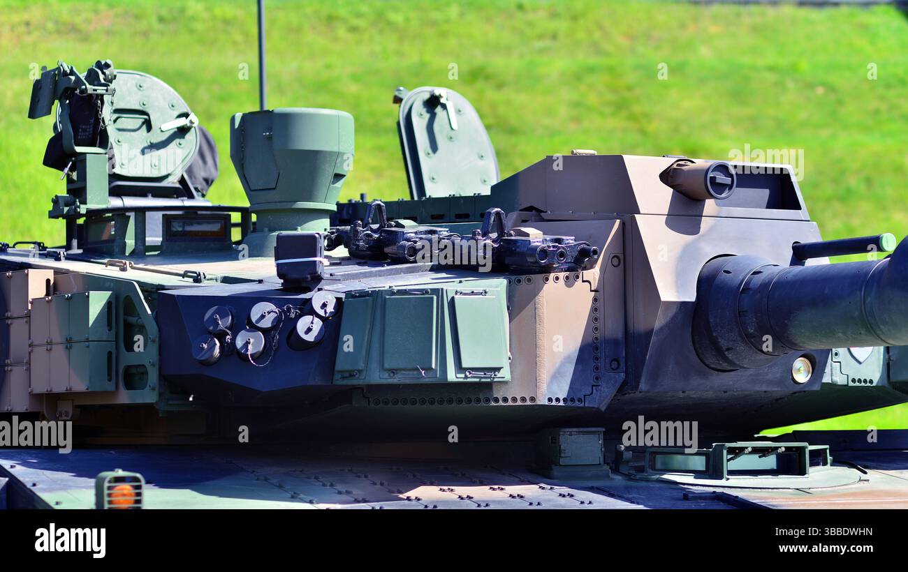 Heavy military tank vehicle turret gun aiming on a target and ready to ...