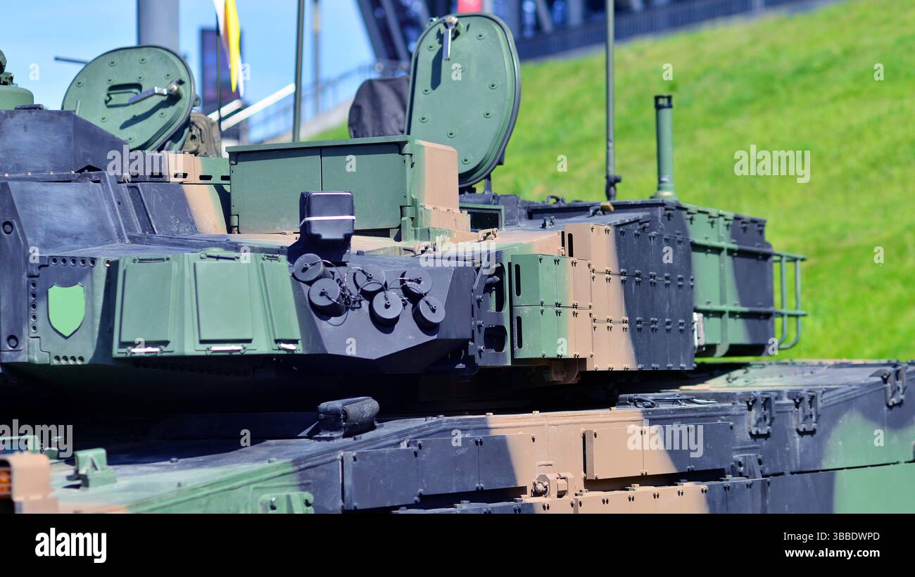 Heavy military tank vehicle turret gun aiming on a target and ready to ...