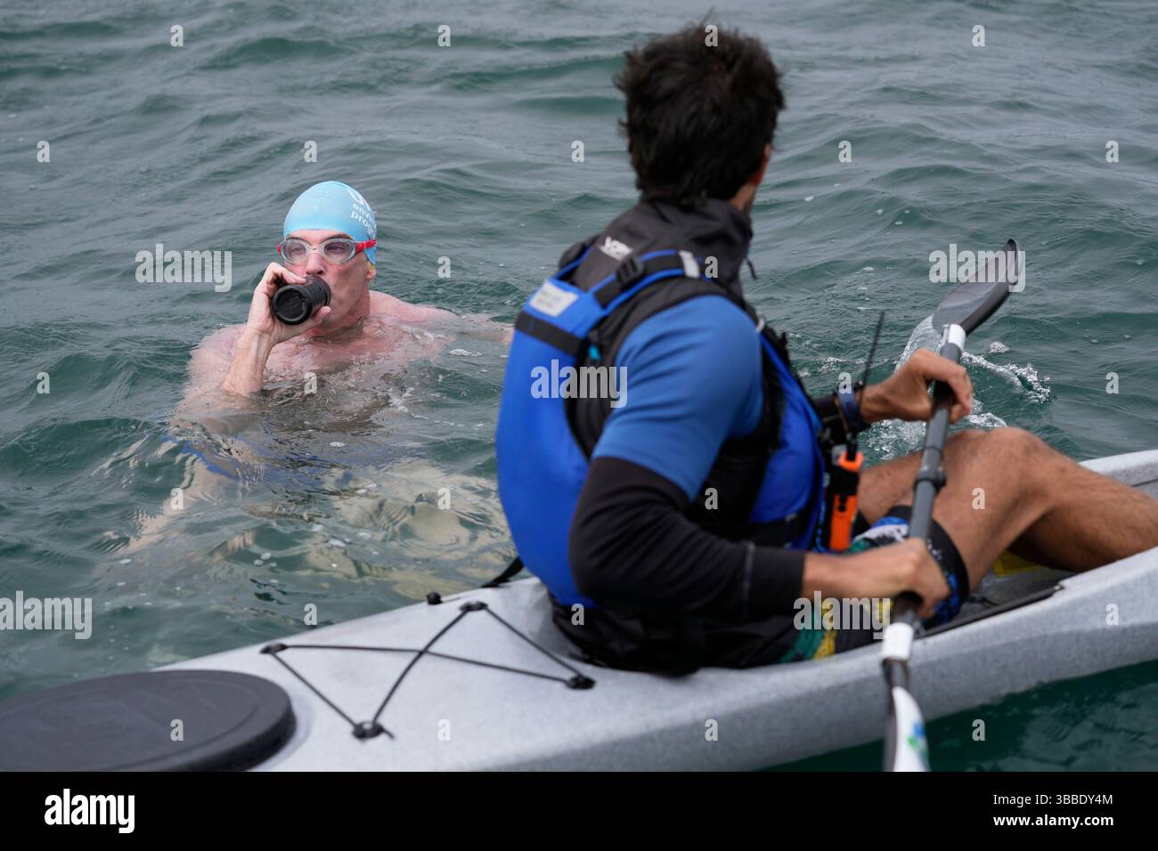 Endurance swimmer Lewis Pugh pauses to rehydrate during the first day ...