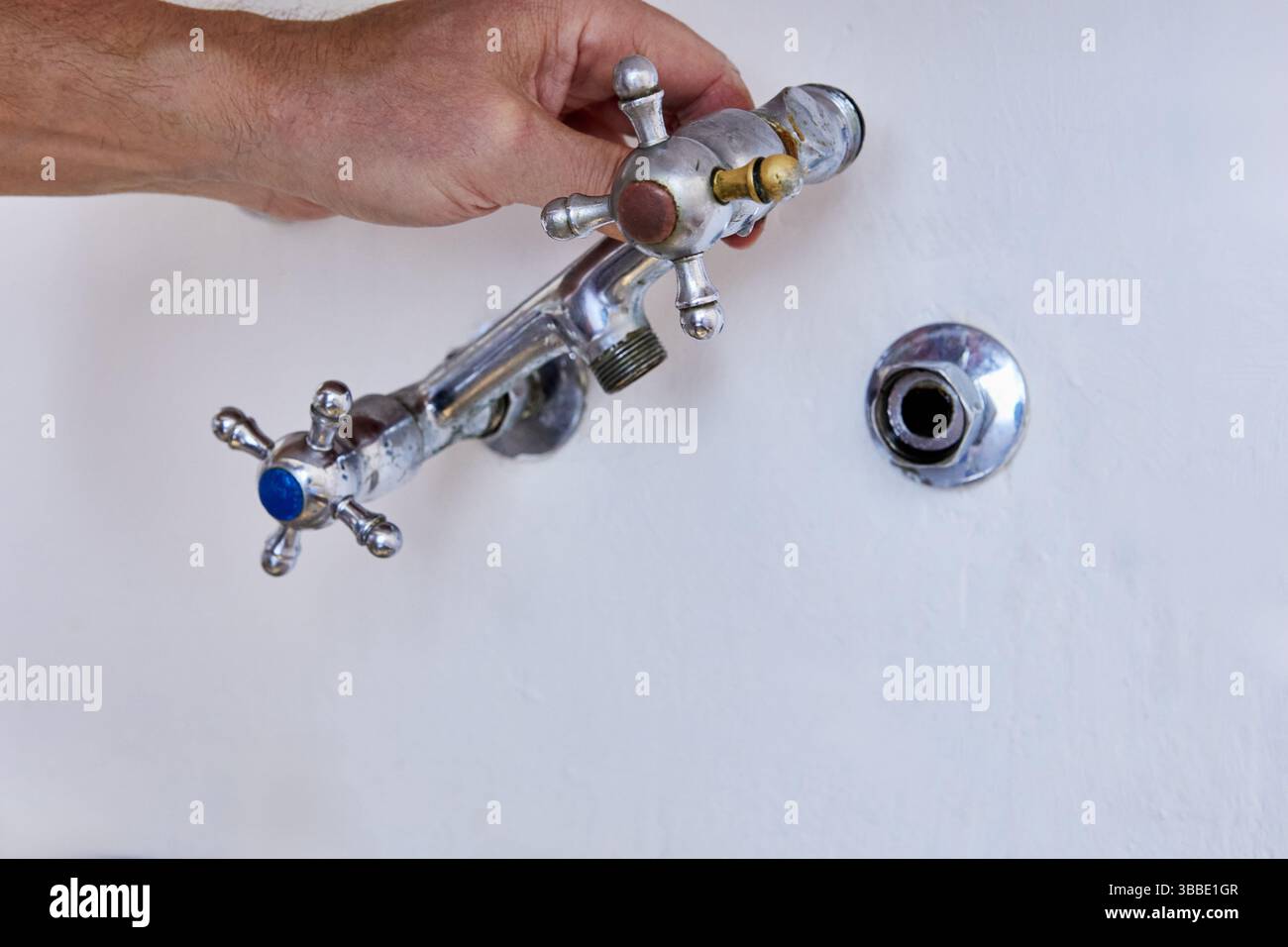 Detaching vintage dual handle mixer tap from concealed plumbing inside ...