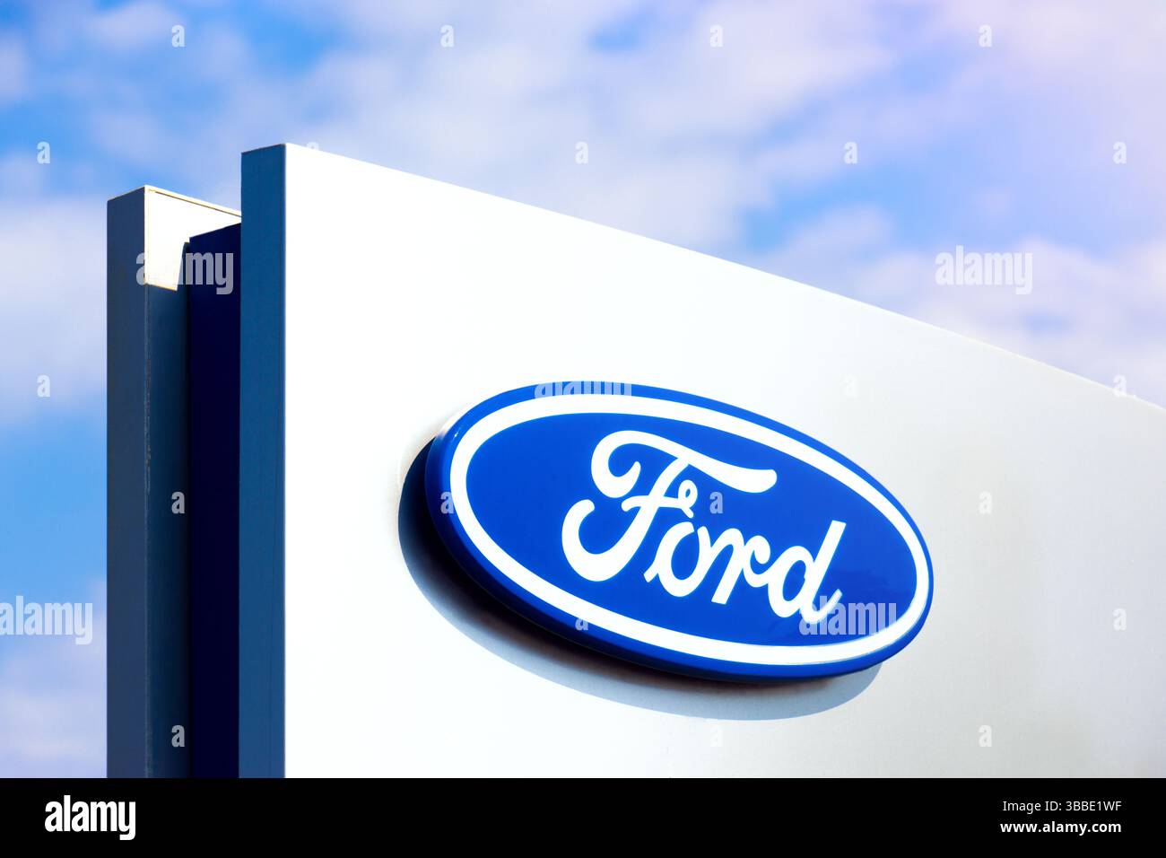 Ford logo on dealership business sign - Ford Motor Company is an ...
