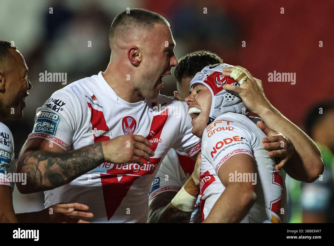 George Whitby of St. Helens celebrates his hat-trick of tries during ...