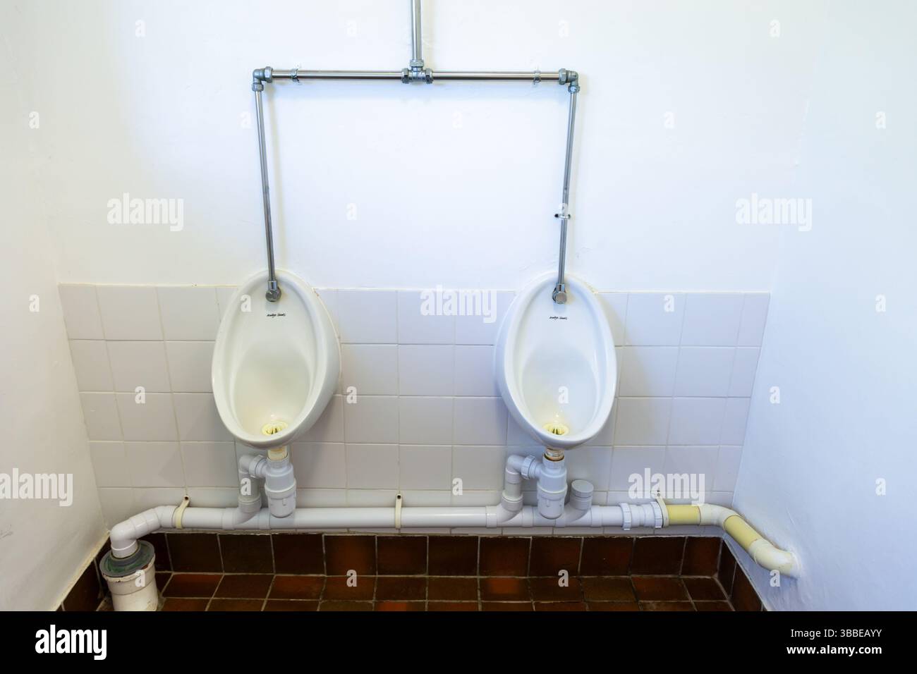Two male urinals in a public toilet, UK Stock Photo - Alamy