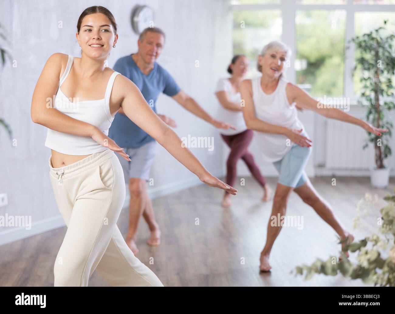 Group of people of different ages dancing in studio Stock Photo - Alamy