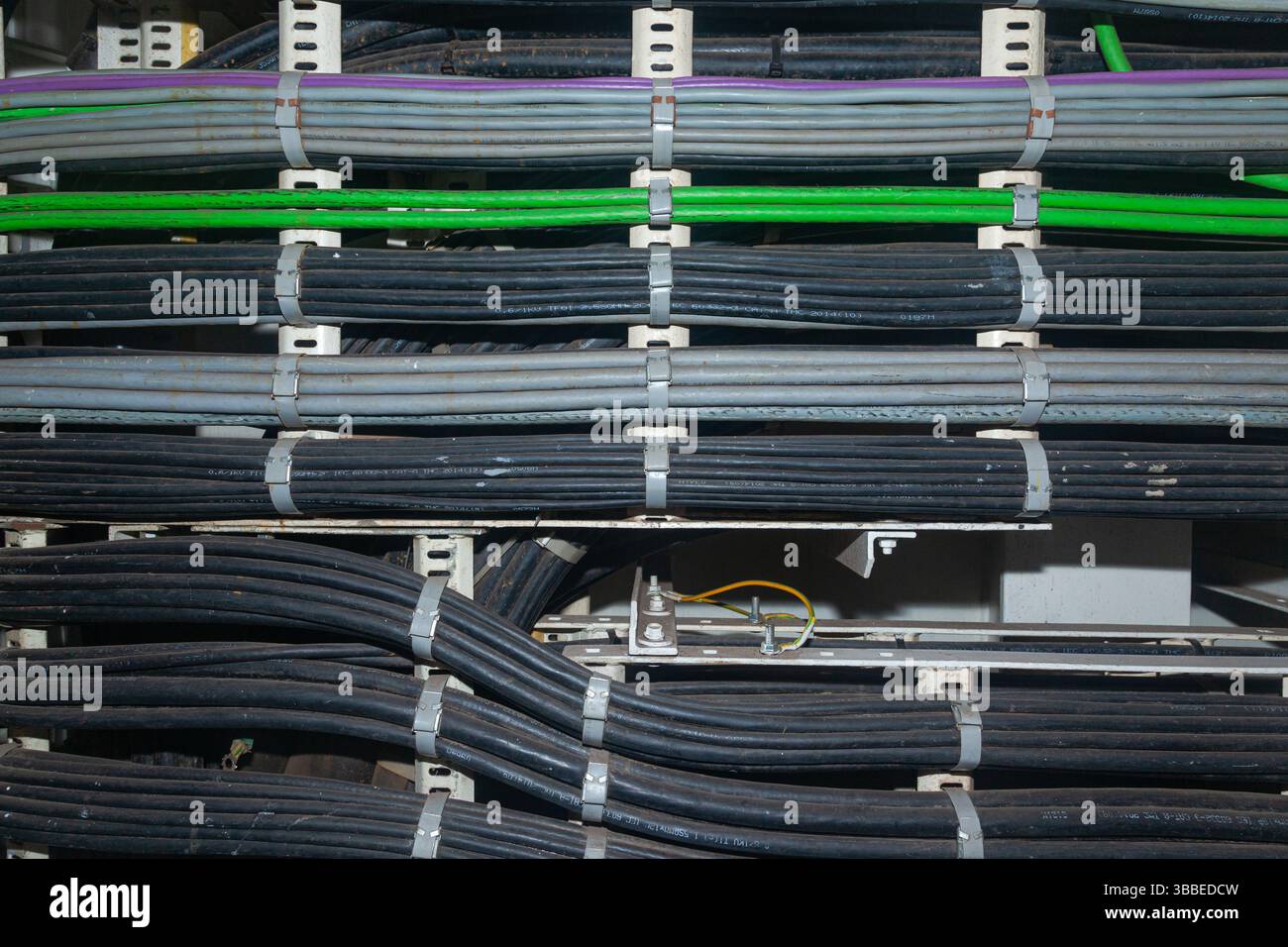 Line of installed industrial electrical cables Stock Photo - Alamy