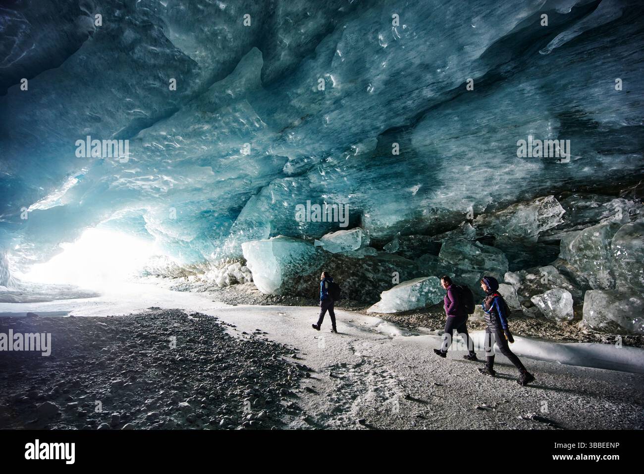 Hikers walking through Morteratsch Glacier Ice Caves, Switzerland, Europe Stock Photo - Alamy