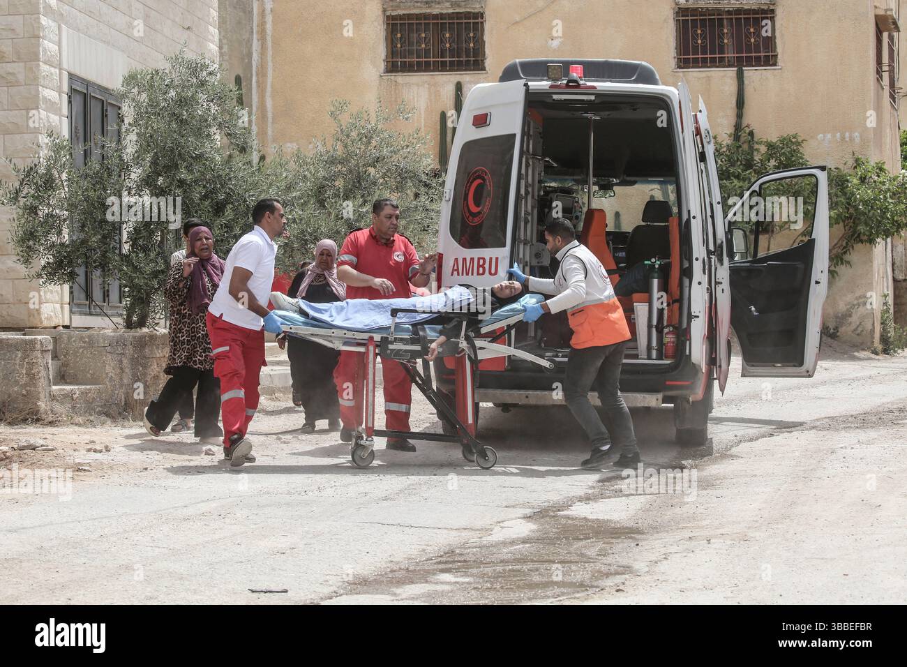 Nablus, Palestine. 15th May, 2025. Medical personnel evacuate a ...