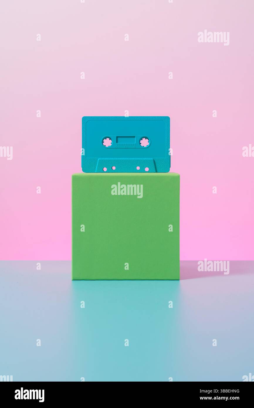 Audio cassette tape template concept studio shot on pink blue green ...