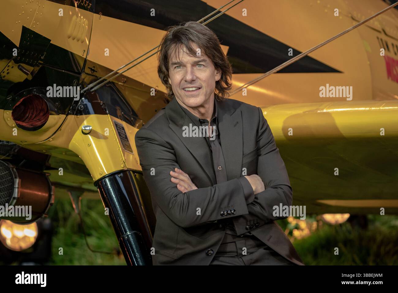 London, UK. 15th May, 2025. Tom Cruise poses with a yellow stunt ...