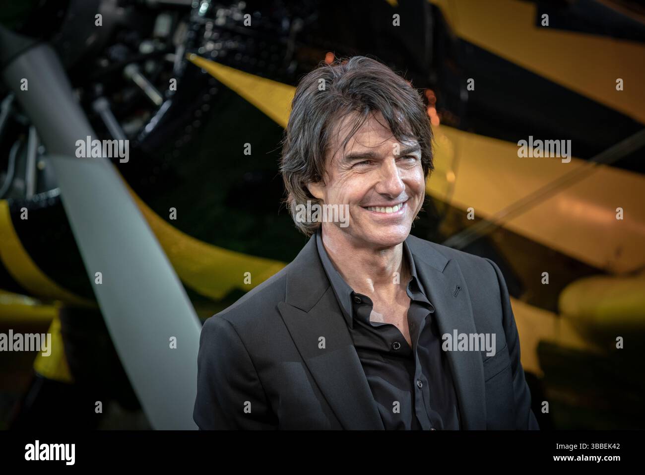 London, UK. 15th May, 2025. Tom Cruise poses with a yellow stunt ...