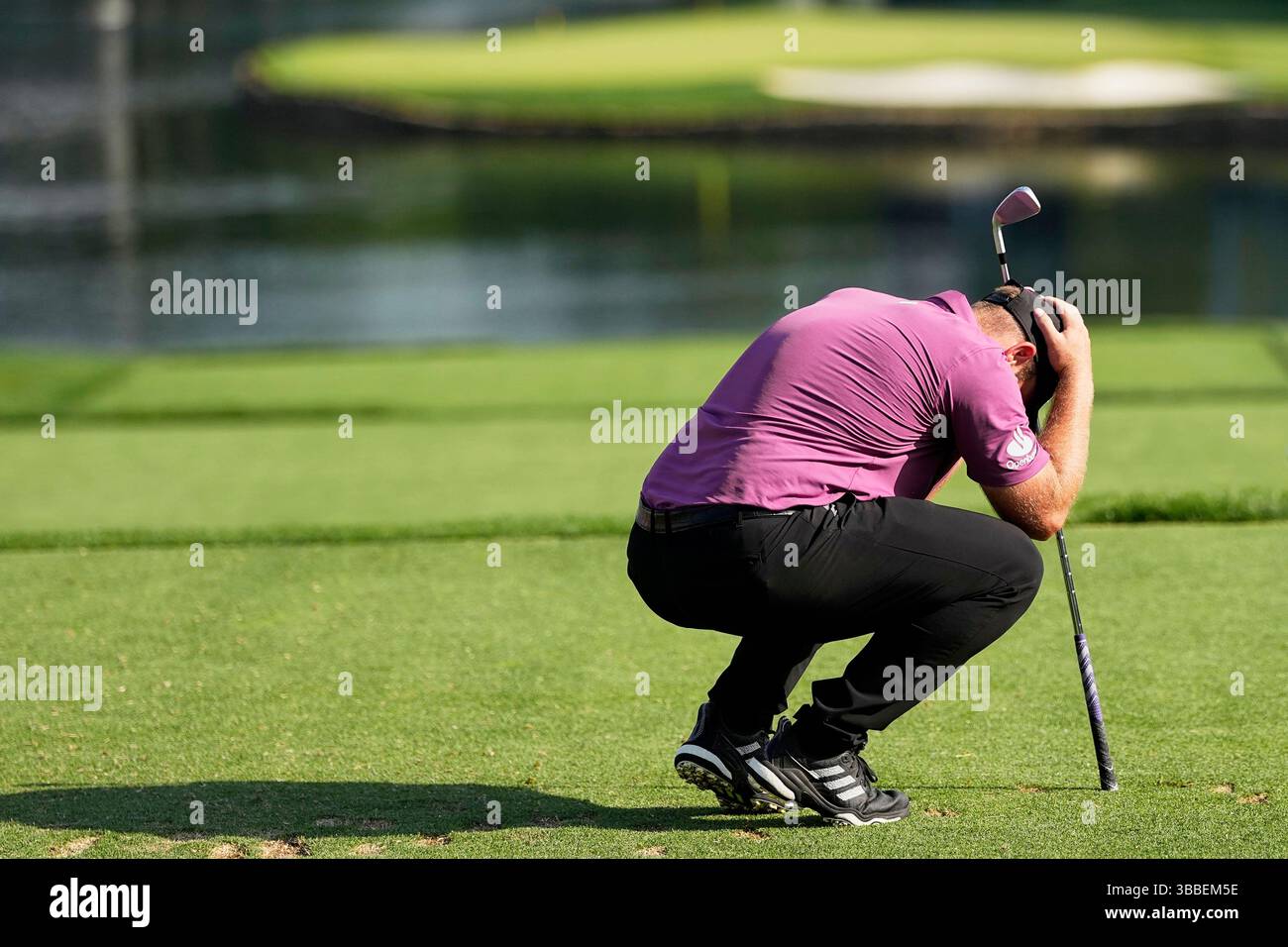 Tyrrell Hatton, of England, reacts to his tee shot on the 17th hole ...