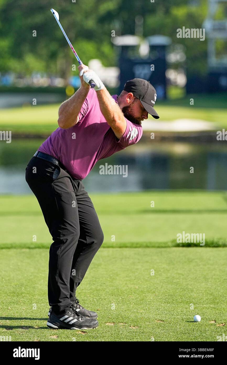 Tyrrell Hatton, of England, hits to his tee shot on the 17th hole ...