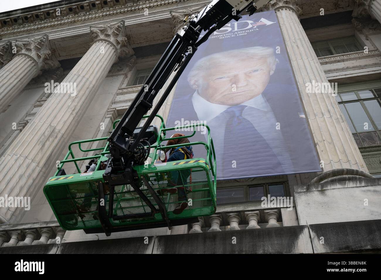 Washington, United States. 14th May, 2025. Workers hang an enormous ...