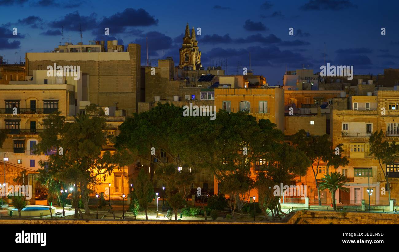 Panoramic night view of a coast line and the downtown of Valletta ...