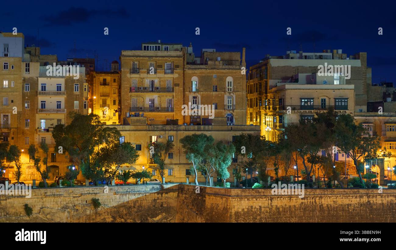 Panoramic night view of a coast line and the downtown of Valletta ...