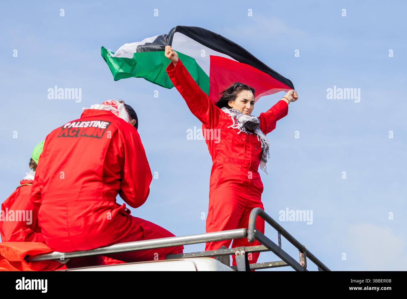 Bristol, UK. 15 MAY, 2025. Dr Rahmeh Aladwan holds Palestine flag as ...