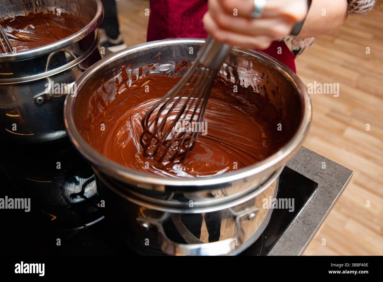Whisk stirring rich melted chocolate hi-res stock photography and ...