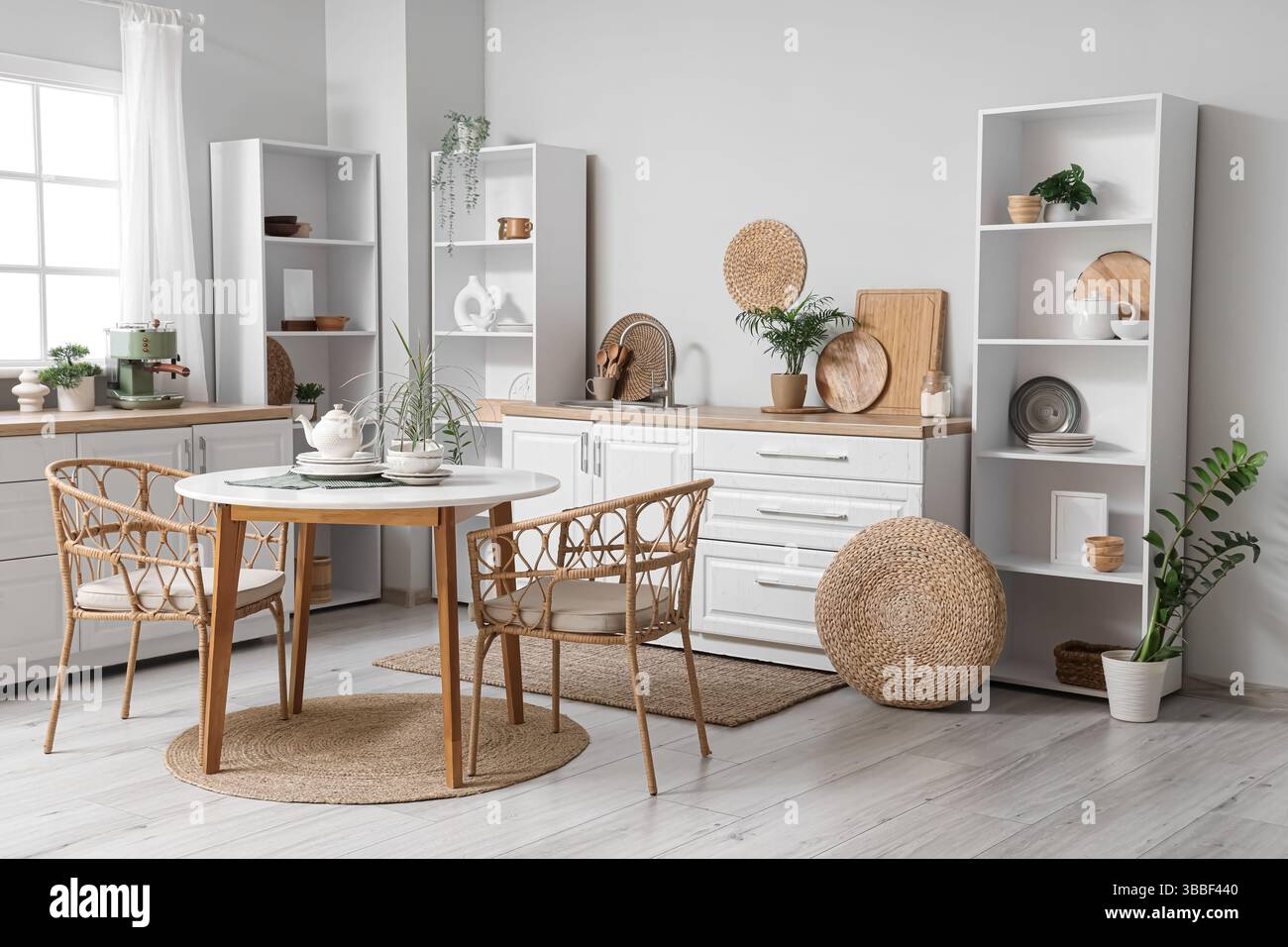 Interior of kitchen with shelf units, counters and dining table Stock ...