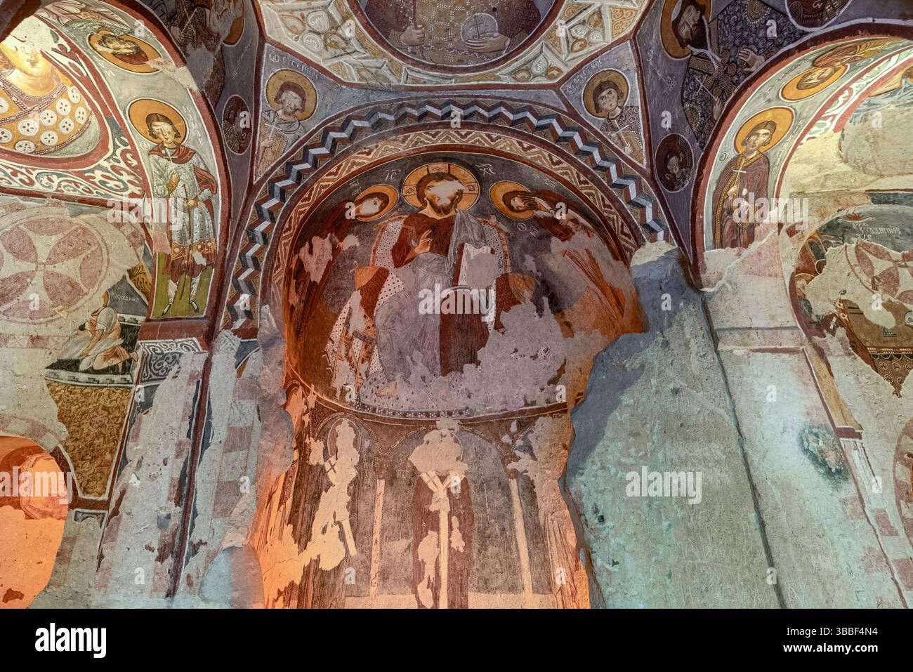 A Deesis fresco in Elmali Church, Goreme, features Christ between Mary and John, all with golden ...
