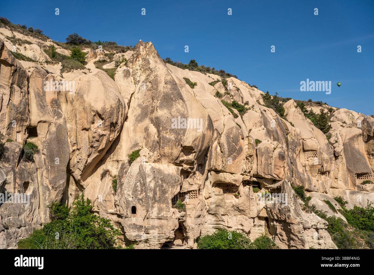 Goreme Open Air Museum displays vast rock walls with natural and carved ...