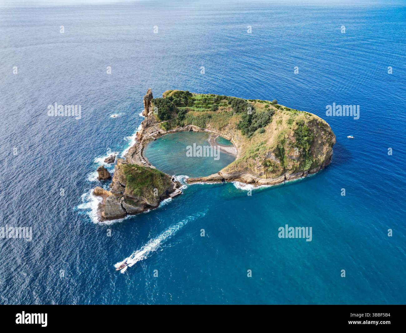 Aerial view of scenic tropical Vila Franca do Campo Islet and a boat ...