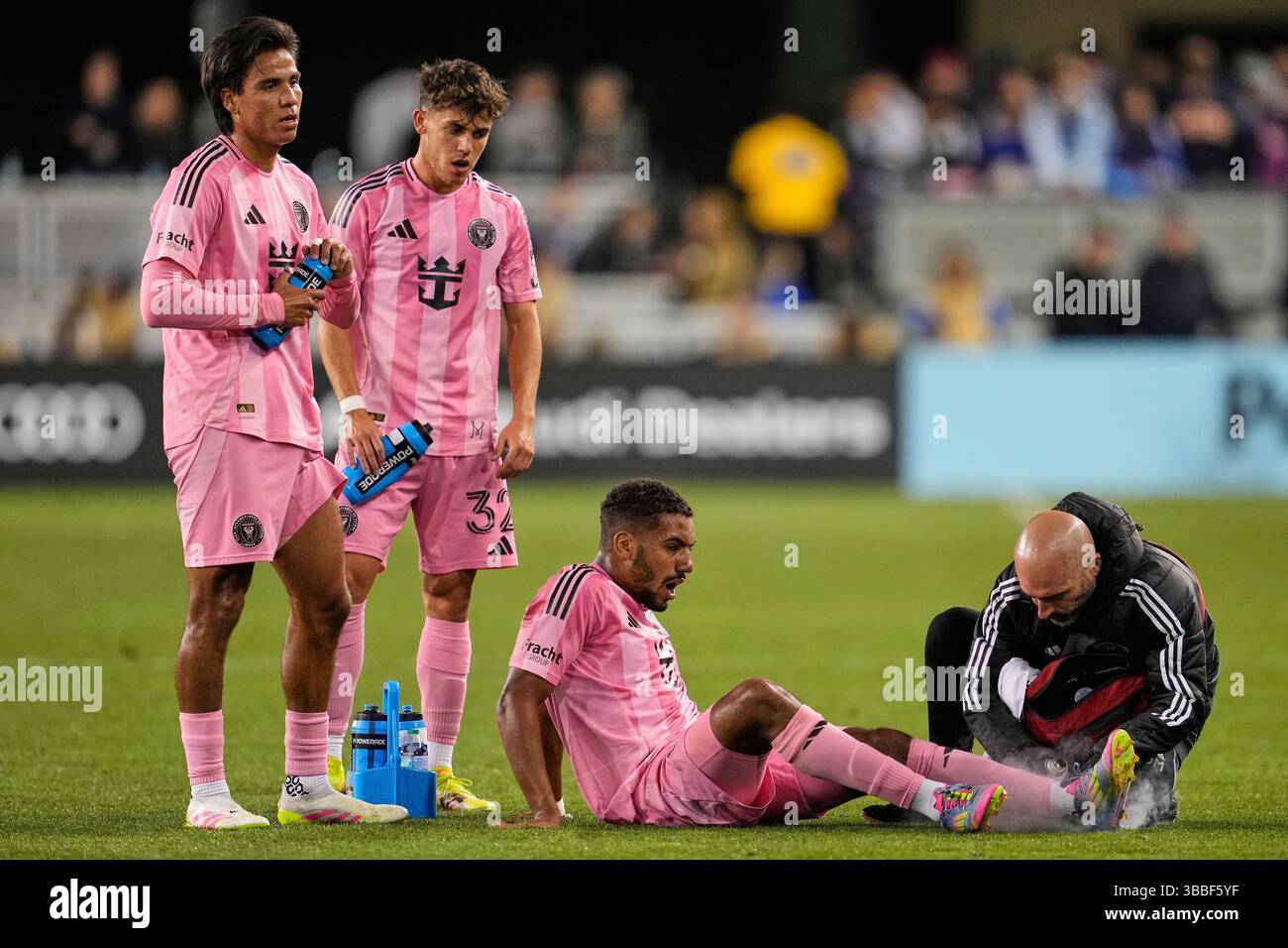 Inter Miami midfielder Yannick Bright, center, receives treatment ...