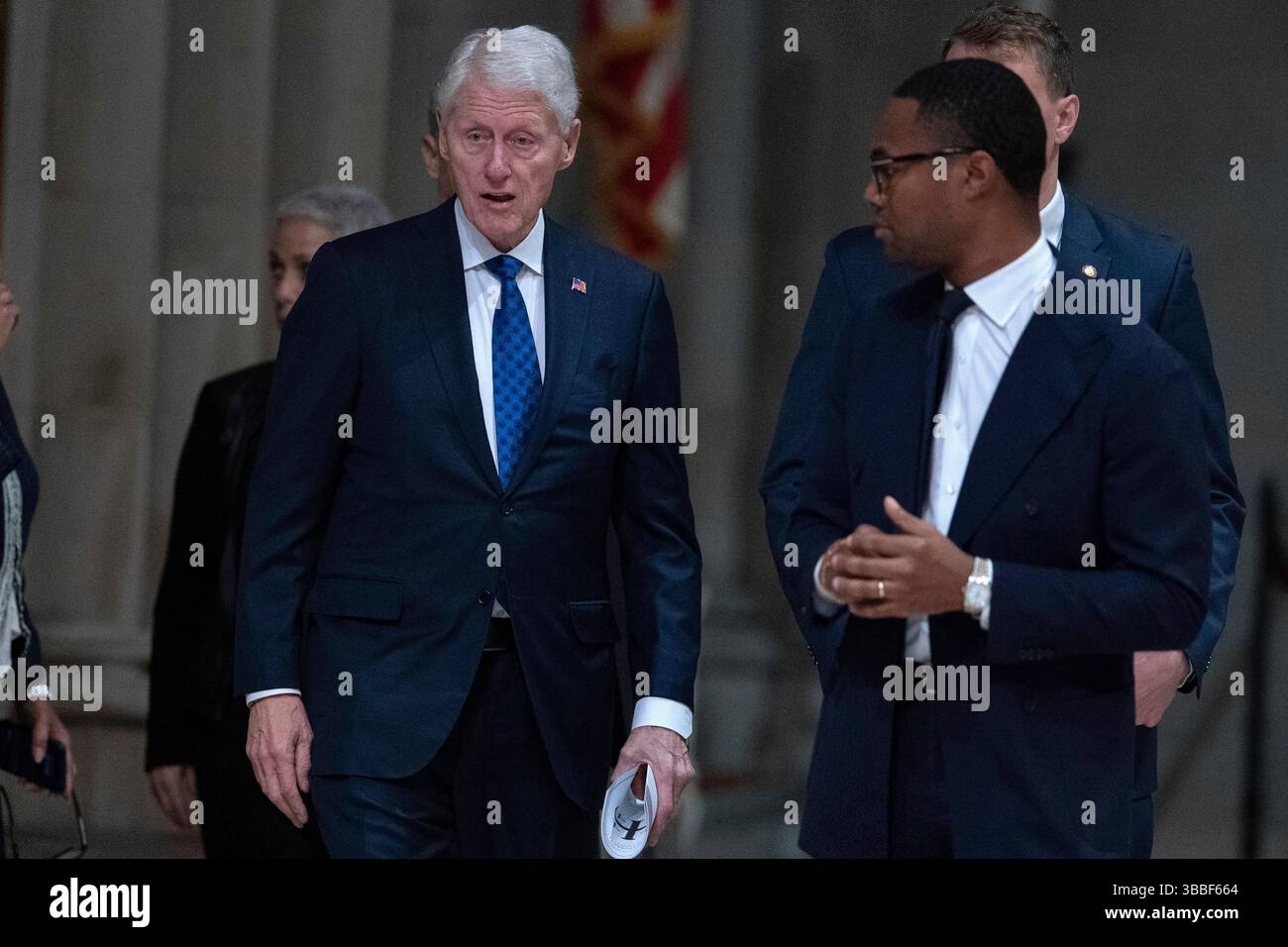 Former President Bill Clinton, left, arrives to the funeral service of ...