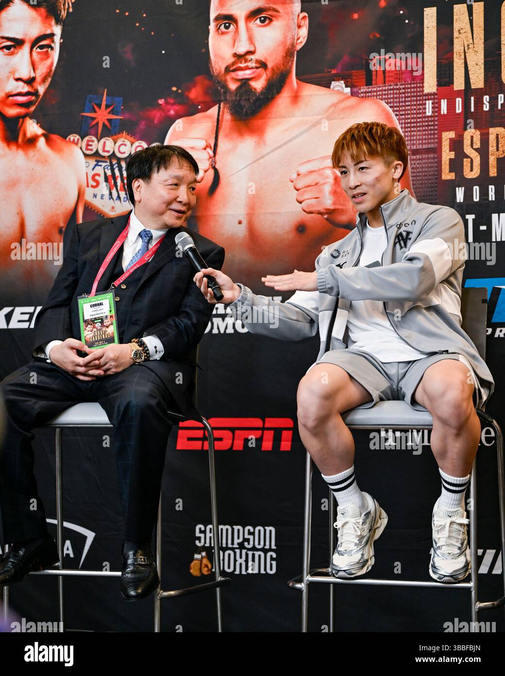 Champion Japan's Naoya Inoue, right, attends a press conference with ...