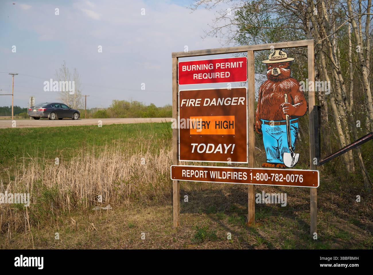 A sign is shown as fire crews continue to fight wildfires around Lac du ...