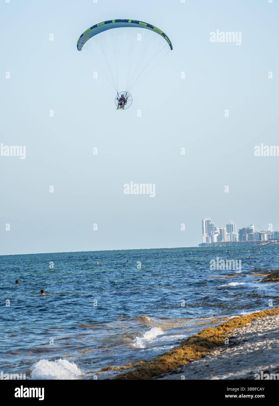 A man flying on a Powered Paragliding apparatus in Hallandale Beach in ...