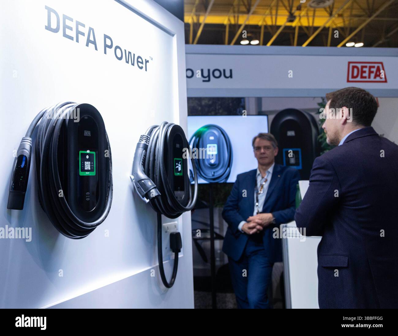 Toronto, Canada. 15th May, 2025. People look at electric vehicle ...