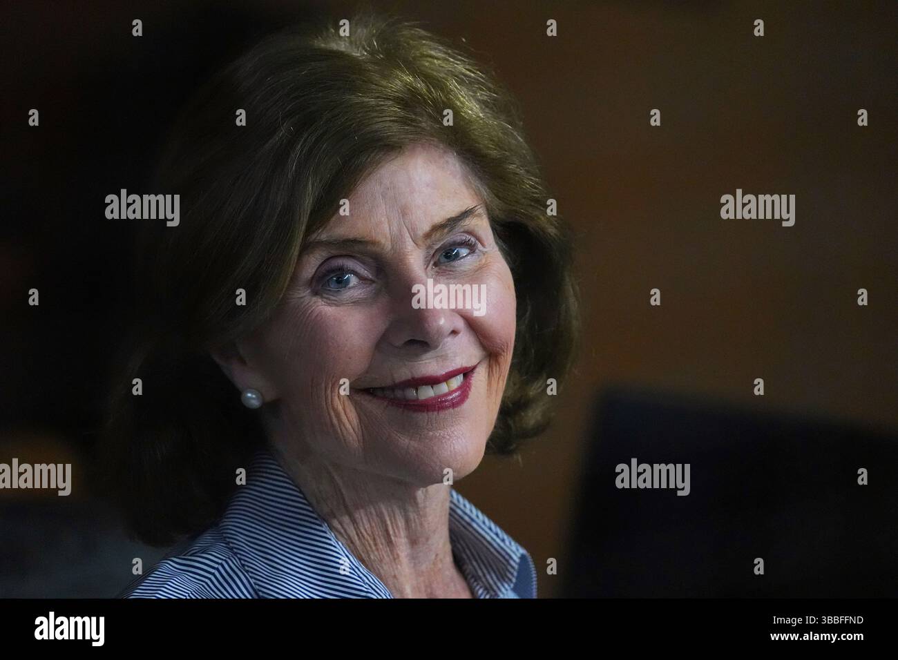 Former first lady Laura Bush attends a baseball game between the ...