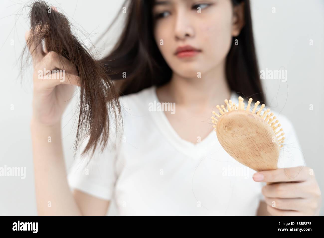 Asian woman very shock looking at damaged hair, hair loss, hair ...