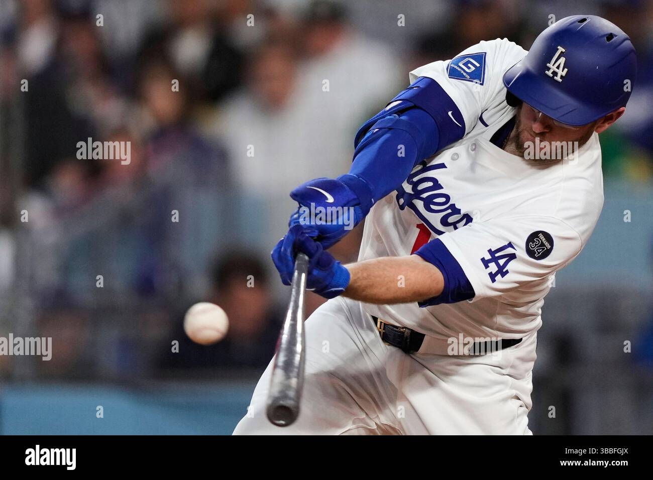 Los Angeles Dodgers' Max Muncy hits an RBI single during the second ...