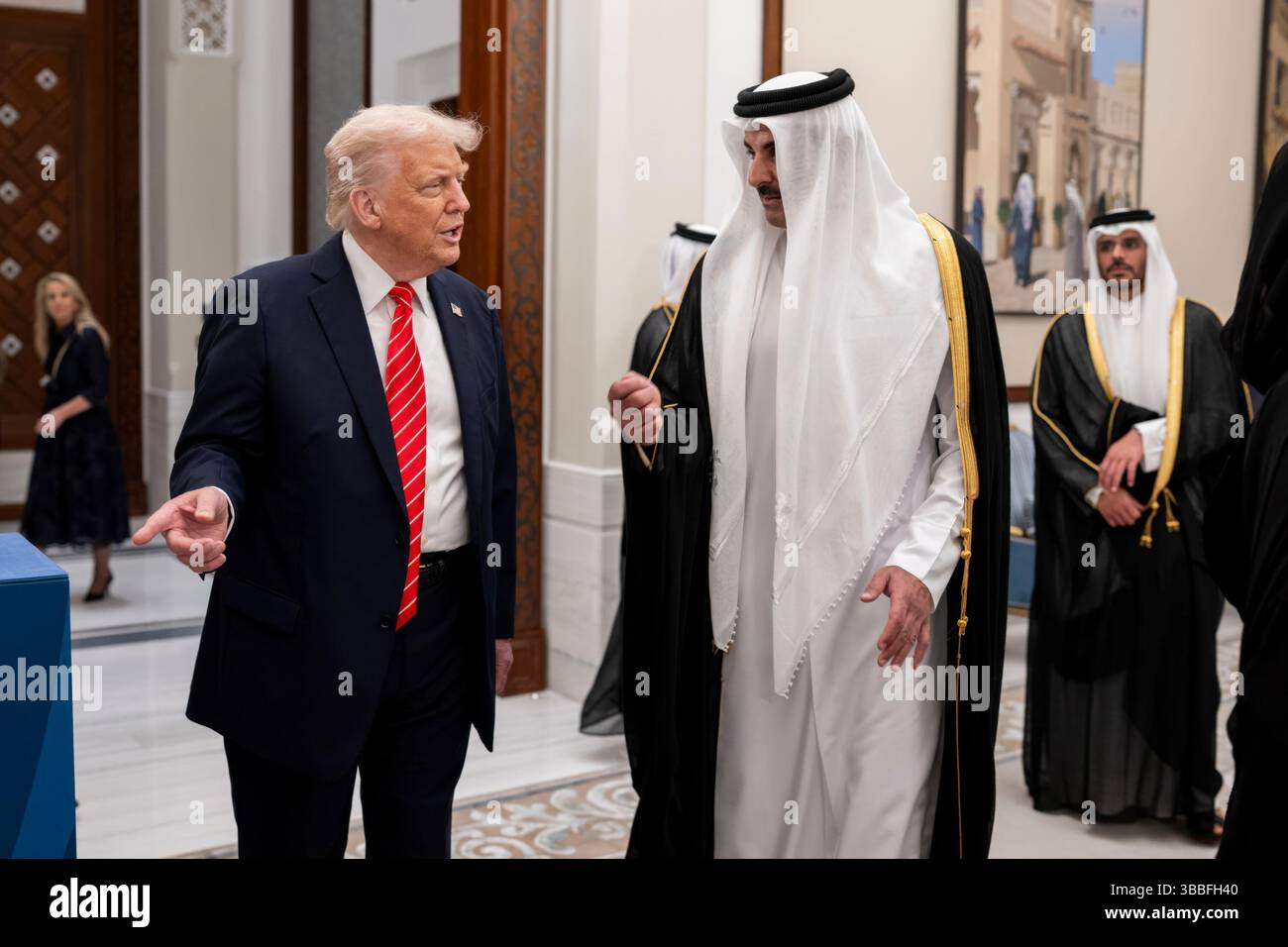 President Donald Trump walks with Amir of Qatar Sheikh Tamin bin Hamad ...