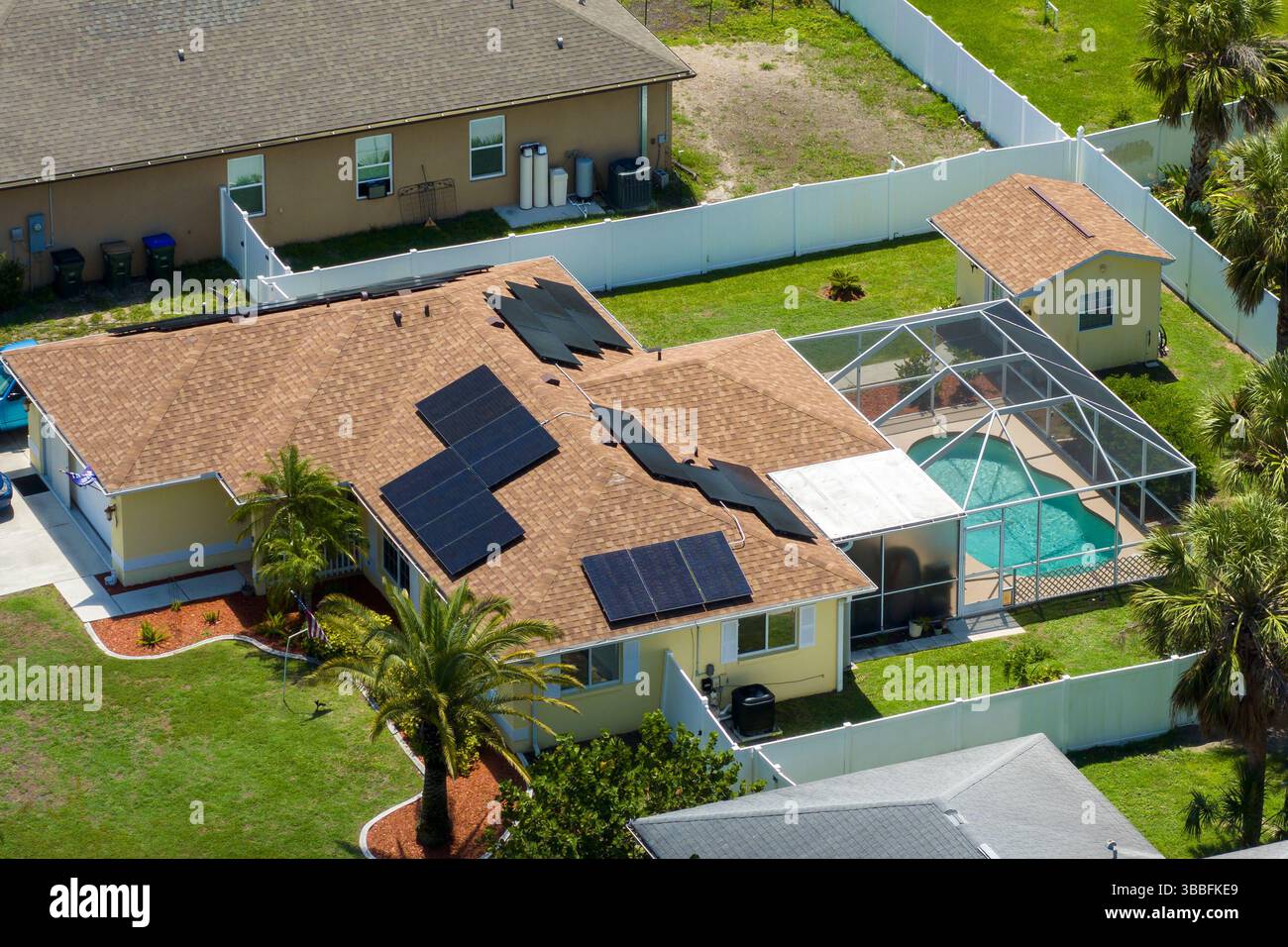 American building roof with rows of blue solar photovoltaic panels for ...