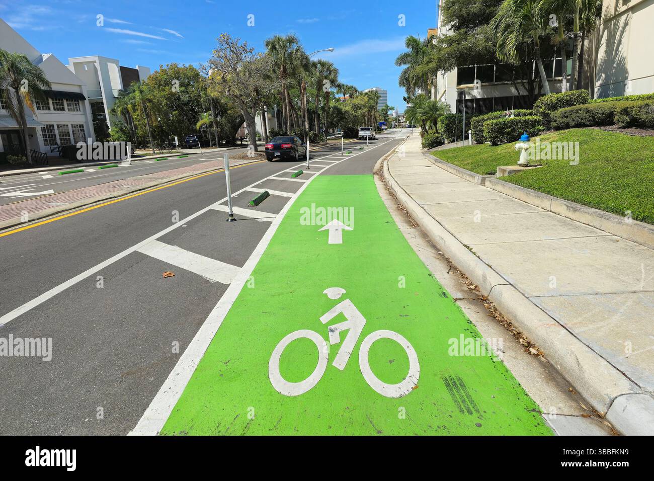 Cycling lane painted green stretches through Sarasota city road with ...