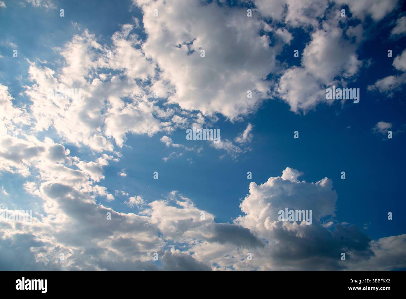Blue sky fluffy white clouds on summer season bright clear skyline with beautiful cloudscape ...